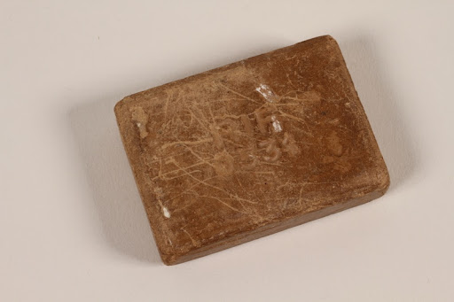 Bar of soap stamped RIF issued to an inmate of Auschwitz-Birkenau ...