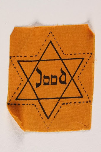 Unused yellow Star of David badge printed with Jood, the Dutch word for ...
